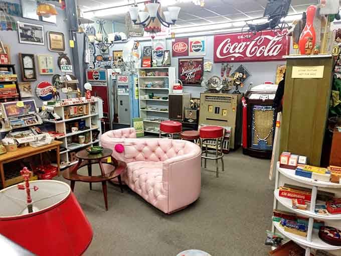 Coca-Cola signs and pink tufted couches coexist peacefully in this wonderland of secondhand splendor.