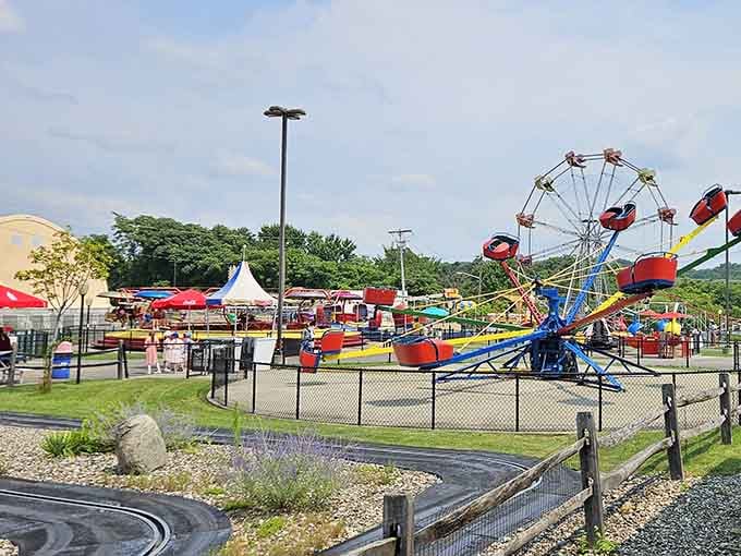 The colorful chaos of classic amusement park rides proves that happiness doesn't require a billion-dollar budget.