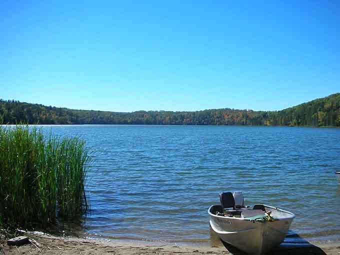 That little boat waiting by the shore knows something you don't: the best fishing spots are just a paddle away.