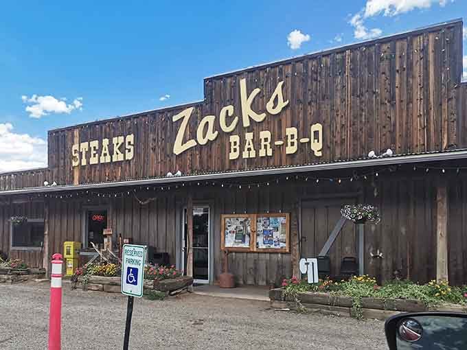 That weathered wood facade isn't trying to impress anyone, just promising honest barbecue under big Colorado skies.