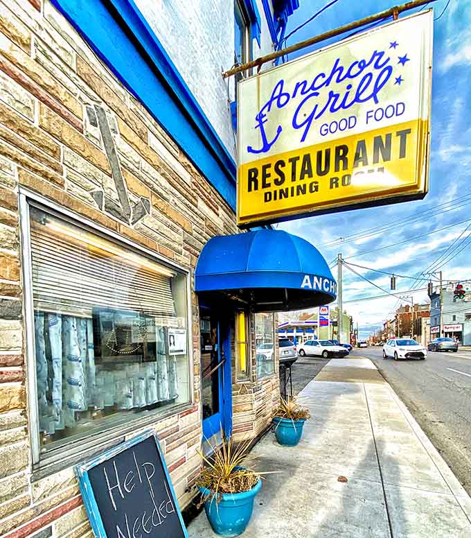 That blue awning and vintage sign promise something special: honest food made right, no frills required.