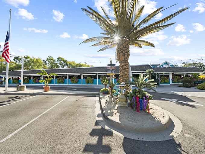 That turquoise exterior with hanging flower baskets isn't just pretty, it's your beacon to fried chicken paradise.