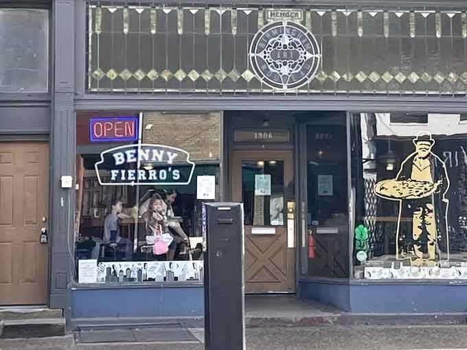 The neon "OPEN" sign is your beacon to carb-loaded glory and slices that require architectural planning.