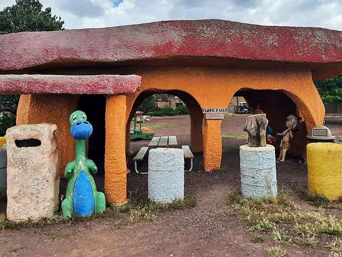 Dino stands guard at this colorful service station where flats get fixed the old-fashioned way, with plenty of charm and whimsy.