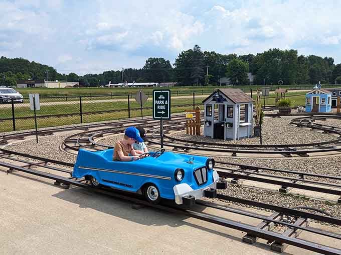 That blue convertible offers more legroom than your first apartment and infinitely more charm than modern bumper cars.