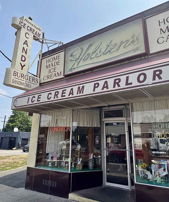 The classic awning and window displays promise homemade treats inside, because some architectural decisions were perfected decades ago and never needed updating.