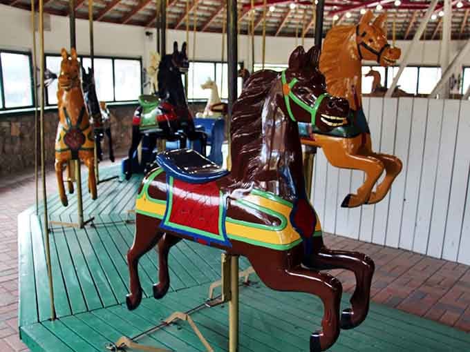Each hand-carved steed tells its own story through intricate saddles and flowing manes that artisans lovingly crafted decades ago.