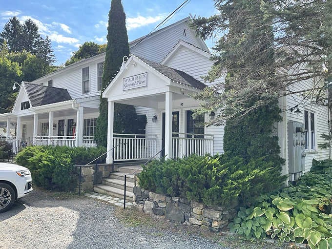 That classic white clapboard exterior isn't just for show; it's your first hint that something special awaits inside.