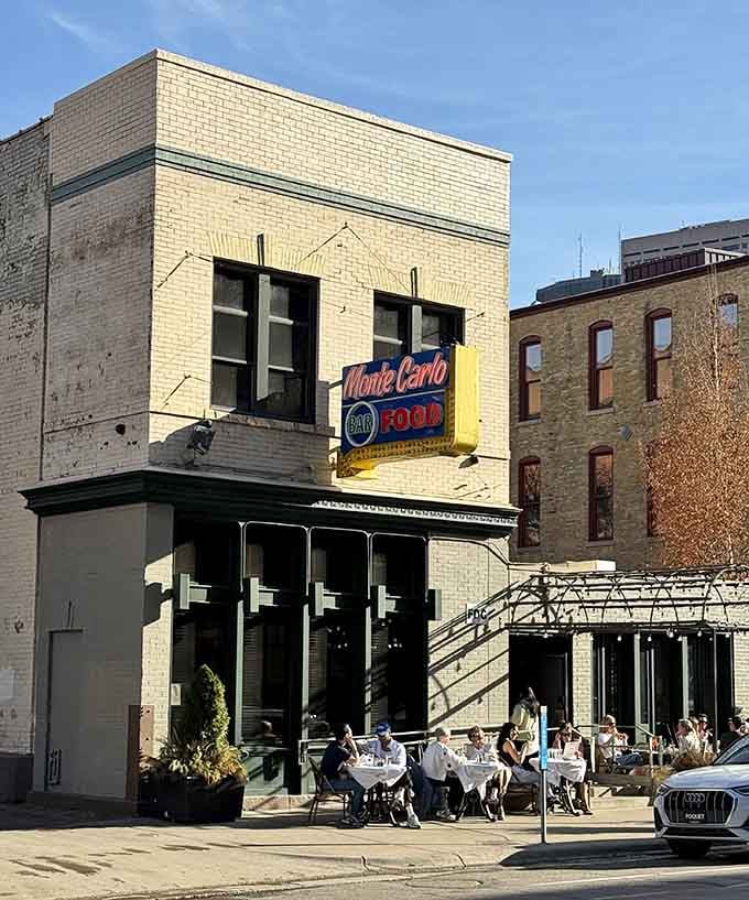 That vintage neon sign beckons like a beacon from a more civilized dining era, promising steaks worth the pilgrimage.