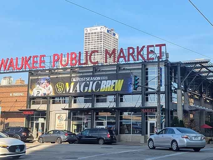 Daylight reveals the modern glass facade where Milwaukee's culinary treasures await behind those welcoming doors and bold red letters.