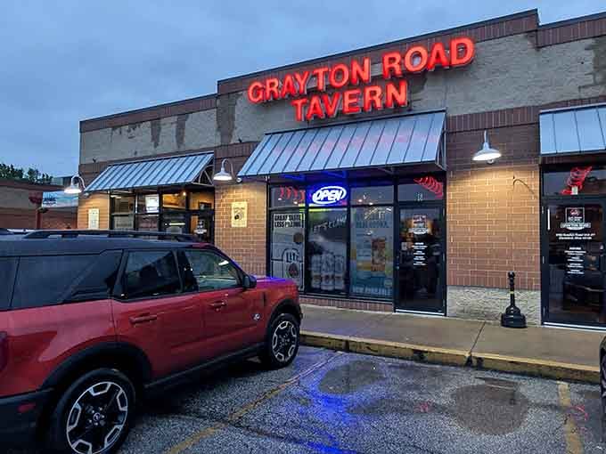 The neon "OPEN" sign glows like a promise that inside, something delicious is waiting just for you.