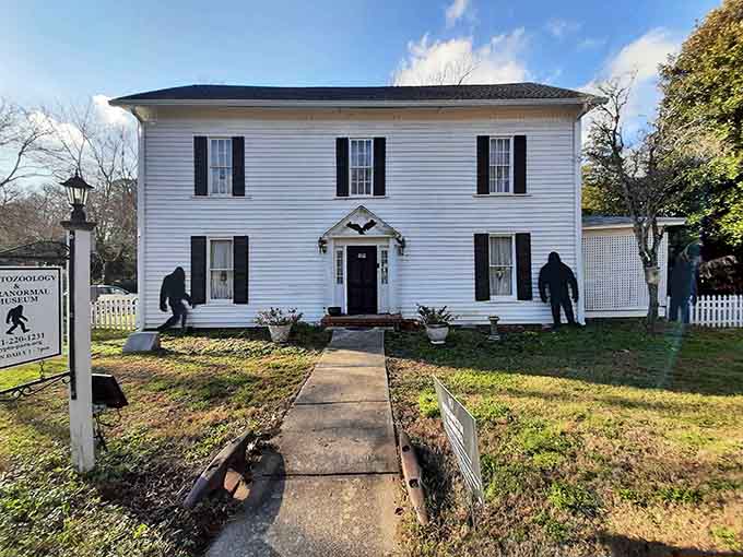 Those Bigfoot silhouettes flanking the pristine white building aren't just decoration, they're your first clue something wonderfully weird awaits inside.