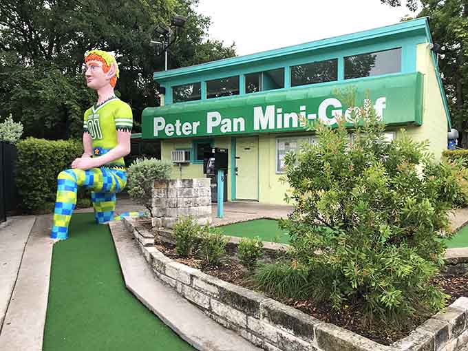 That giant Peter Pan isn't just waving hello, he's basically daring you to stay serious about adulting today.