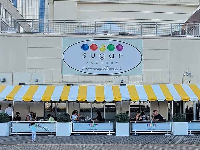That cheerful yellow awning beckons like a lighthouse for anyone whose sweet tooth needs immediate rescue and validation.
