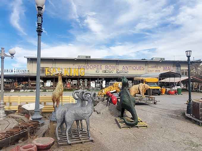 A menagerie of oversized lawn ornaments standing guard like the world's most eclectic welcoming committee ever assembled.