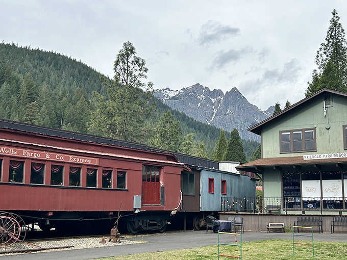 The Wells Fargo Express car sits beneath dramatic mountain peaks, creating a postcard scene you'll actually want to send.