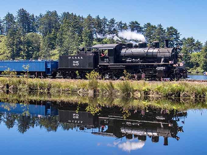 That mirror-perfect reflection proves even locomotives deserve their glamour shots on the Oregon coast.