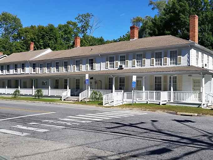 That sweeping porch stretches longer than a Sunday afternoon, inviting you to slow down and appreciate colonial elegance.