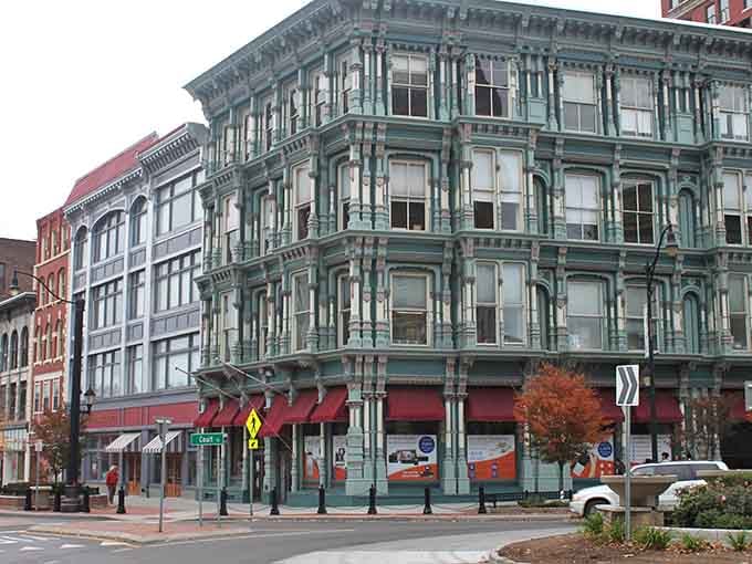 Cast-iron architecture meets small-town charm where every storefront window promises another treasure waiting to be discovered inside.