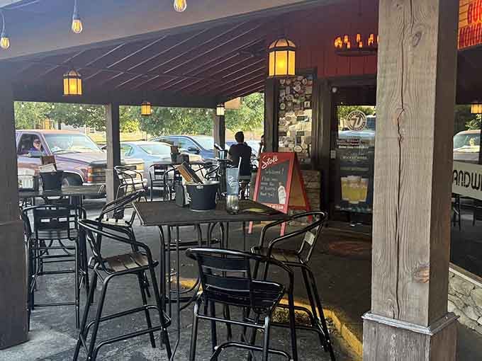 The welcoming patio at Burger Tavern 77 beckons like a friend waving you over for something spectacular.