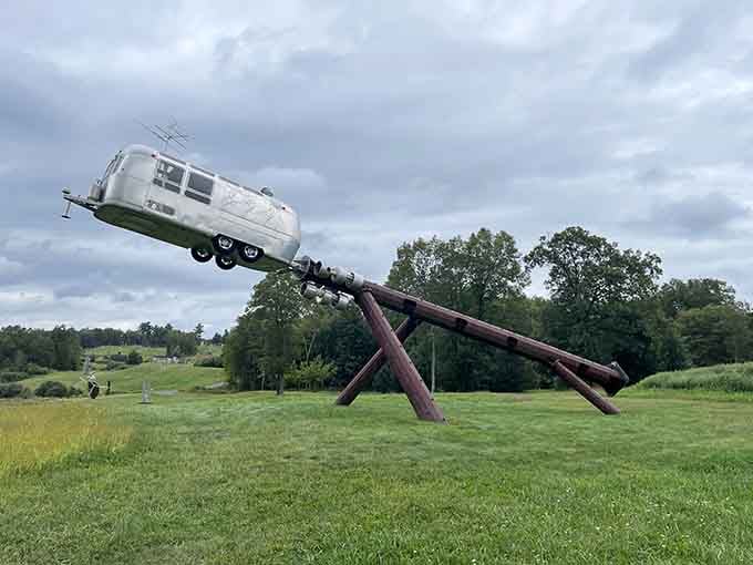Defying gravity and common sense, this Airstream reaches for the sky on its industrial launching pad of dreams.
