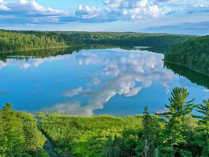 When the lake mirrors the clouds this perfectly, you're not just looking at nature, you're seeing double the beauty.