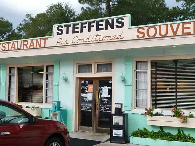 Air conditioning advertised on the sign like it's 1955, because some luxuries never go out of style.