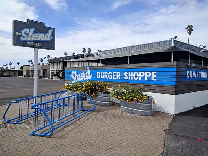 The cheerful blue bike rack and blooming planters prove that even burger joints can have curb appeal worth writing home about.