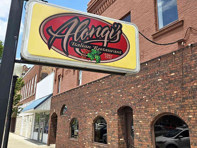 That brick facade has witnessed nearly a century of pizza evolution, standing proud like a delicious time capsule.