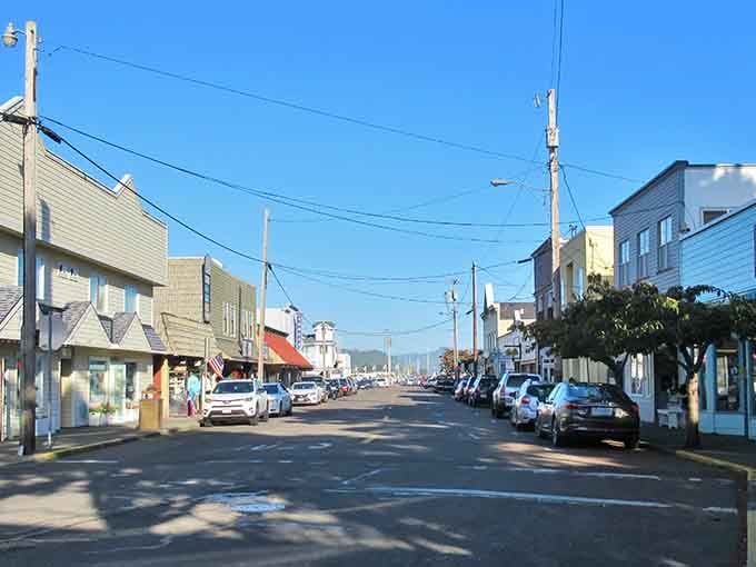 Main Street stretches toward distant mountains under endless blue sky, proving small-town charm doesn't need skyscrapers.