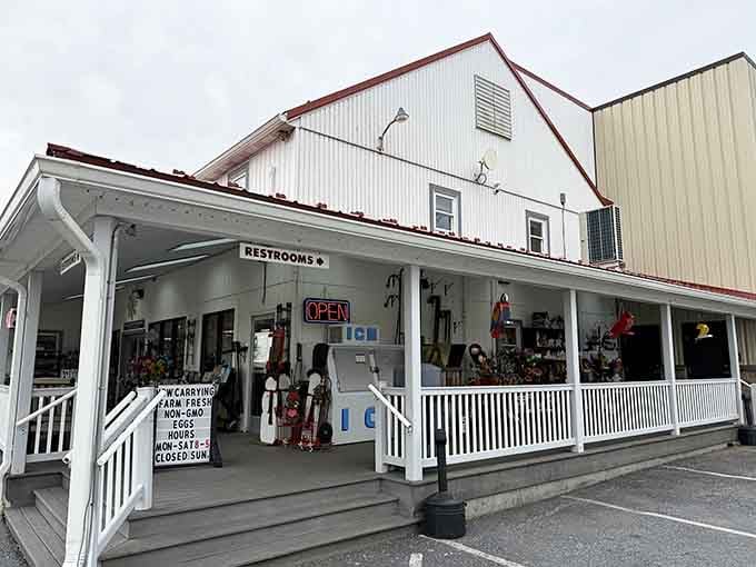 That covered porch and those white railings are calling your name louder than your GPS ever could.