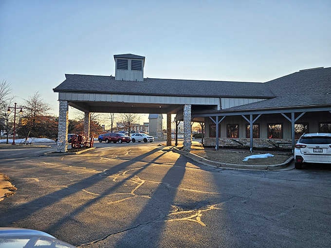 The stone pillars and covered entrance whisper "welcome home" louder than any greeter ever could.