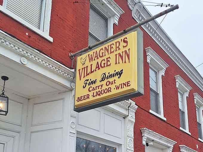 That yellow sign isn't just pointing you toward dinner; it's pointing you toward some of the finest fried chicken in the entire state.