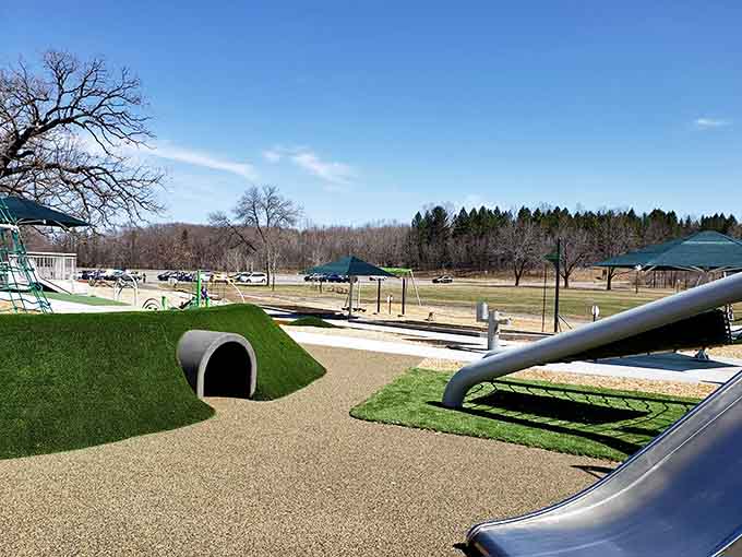 This modern, creative playground features fun tunnels and exciting slides, providing a perfect outdoor space for an energetic afternoon adventure.