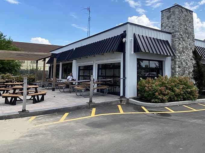 That stone chimney and casual vibe tell you everything: this is where locals come for seriously good fish.