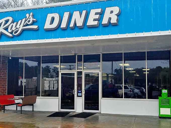That bright blue sign isn't just directing you to breakfast, it's pointing toward pure morning happiness.