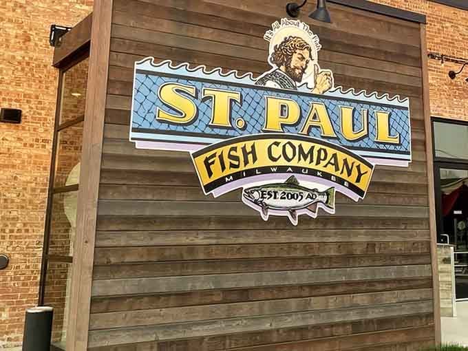 The vintage signage and brick facade create an inviting entrance that whispers "fresh seafood" louder than any billboard.