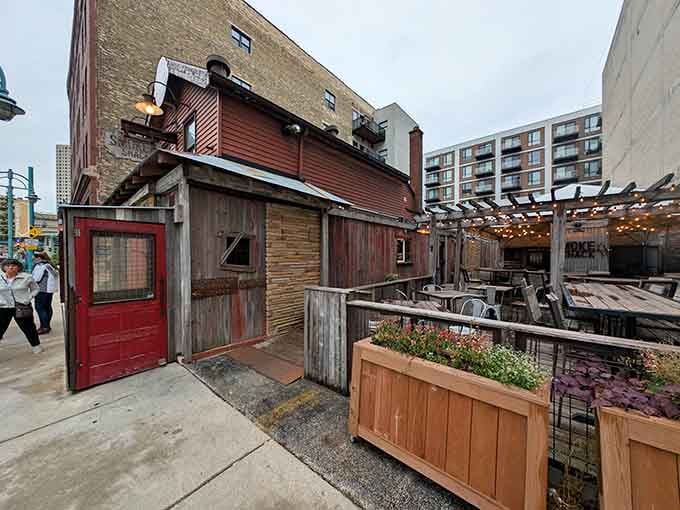That rustic red door isn't just an entrance, it's a portal to barbecue bliss in downtown Milwaukee.