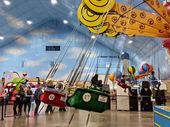 Nothing says "we've conquered the elements" quite like carnival swings twirling under a perpetually sunny artificial sky.