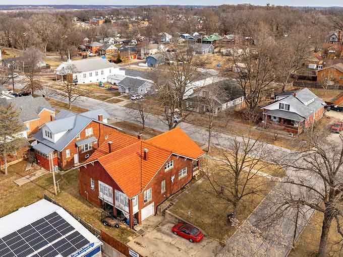 Those orange rooftops pop against winter trees like autumn decided to stick around just a little longer.