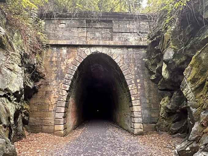 That weathered brick archway looks like the entrance to Narnia, except instead of a wardrobe, you walk through a mountain.