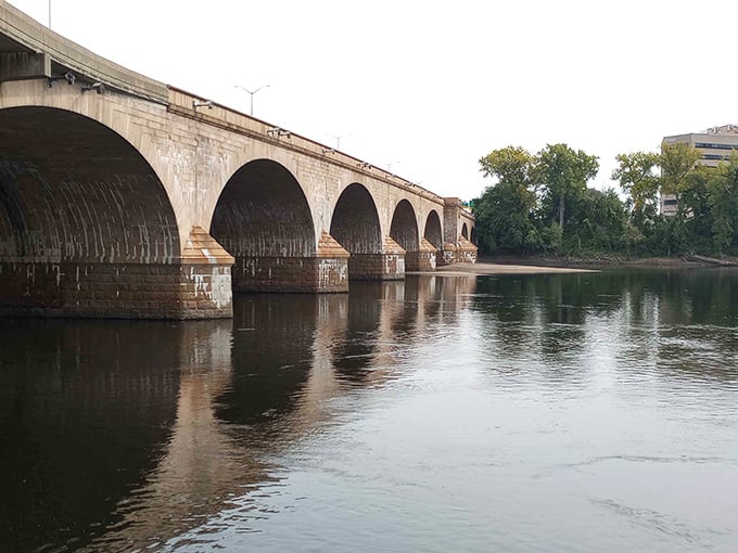 Perfect arches marching across the Connecticut River like they own the place—because honestly, they do.
