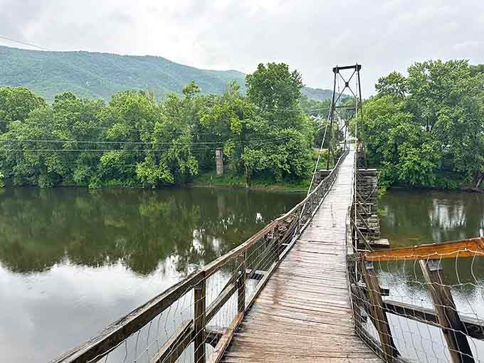 The Historic Buchanan Swinging Bridge stretches across the James River like nature's own tightrope act.