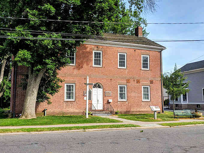 Classic colonial architecture like this perfectly preserved brick building showcases why Wethersfield feels like stepping directly into an earlier American era.