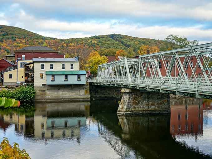 Those hills wearing their autumn best while the river mirrors it all back&mdash;nature showing off shamelessly.