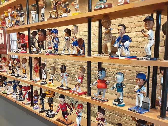 Rows of bobbling heads line the shelves like a who's who of pop culture history frozen in perpetual nodding agreement.