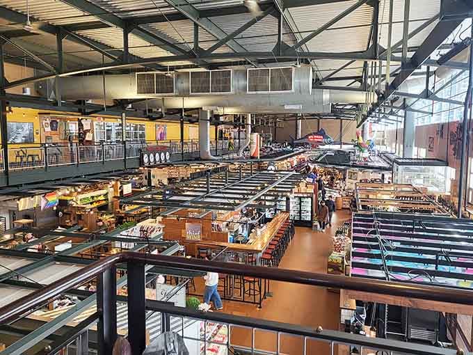 This bird's-eye view showcases the bustling food hall where every vendor stall promises a different delicious adventure under one spectacular roof.