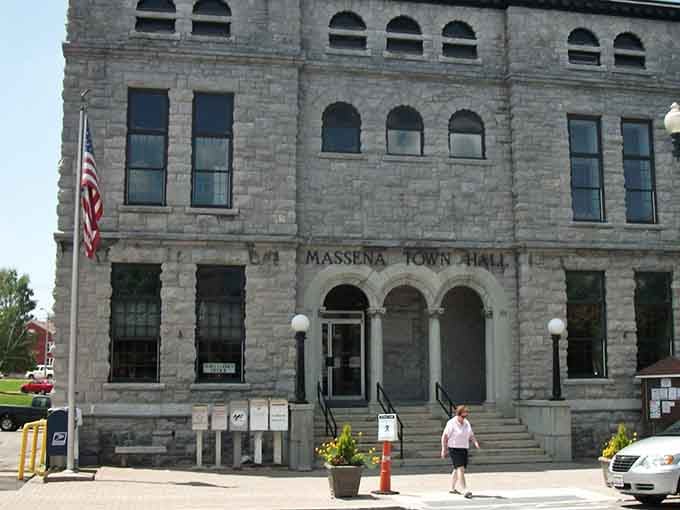 That gorgeous stone facade and those arched windows prove government buildings used to have actual personality and charm.