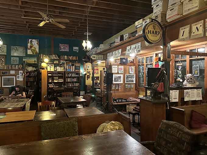 Evening light spills across tables and shelves in this wonderfully cluttered space that feels like home before you've ordered.