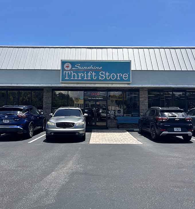 That cheerful blue sign promises treasure hunting under the Florida sun, where parking lots lead to possibilities.